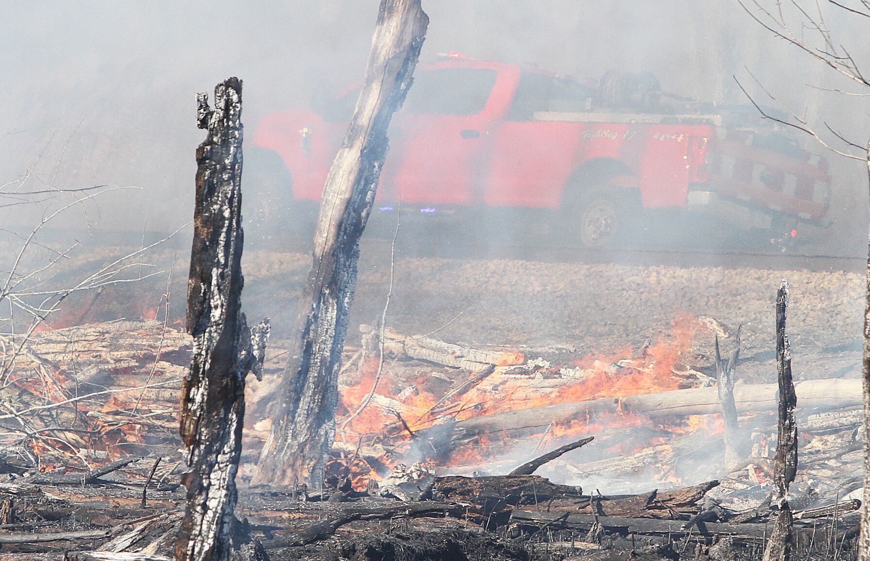 Firefighters fight brush fire in Carbon Cliff Feb. 27