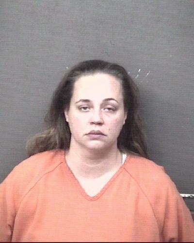 Woman accused of firing gun during struggle