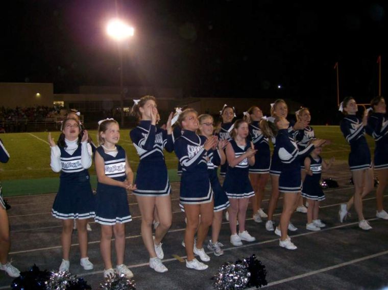 Local cheerleading squad 'Sparkles' with help from their new friends