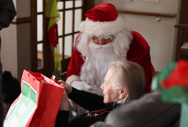 Brian Phillips plays Santa for County Manor Memory Care