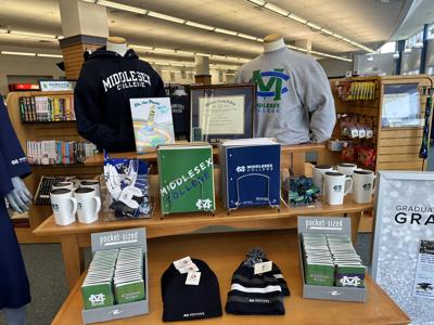 College Hosts Graduation Fair Bookstore Dispenses Caps and Gowns, Sells ...