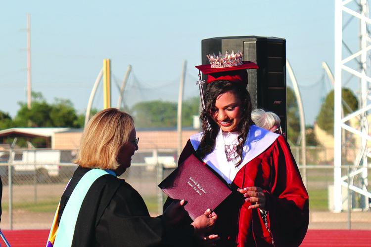 Scenes from graduation ceremonies for University and Roswell high ...