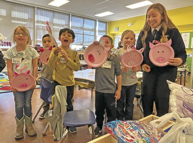 Feeding birds and naming pigs — elementary school students study farm ...