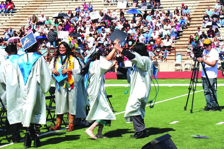 Picturing the Day—Graduation scenes from Goddard and Early College high ...