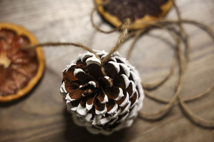PHOTOS: How to create a festive dried orange and pinecone garland ...