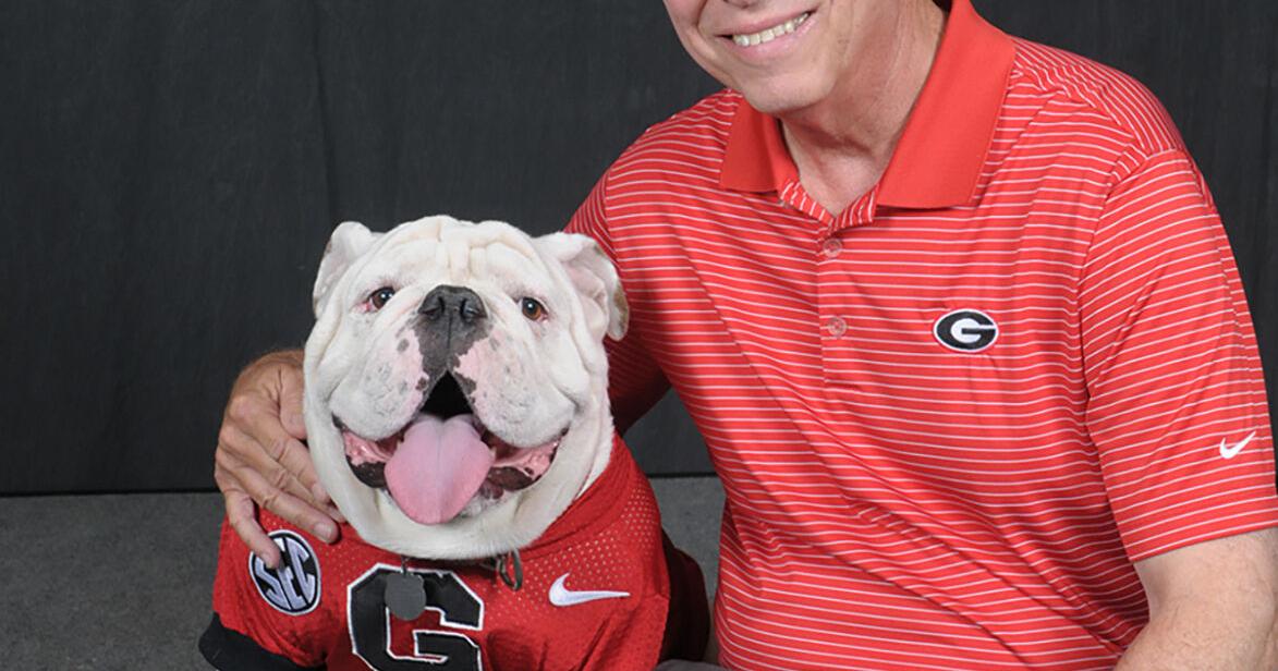 UGAAA Courtesy Claude Felton poses with Uga X | | redandblack.com