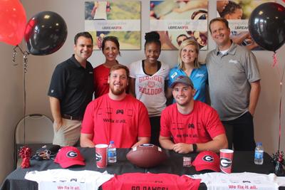Former Bulldogs Marshall Morgan and John Theus help open new store ...