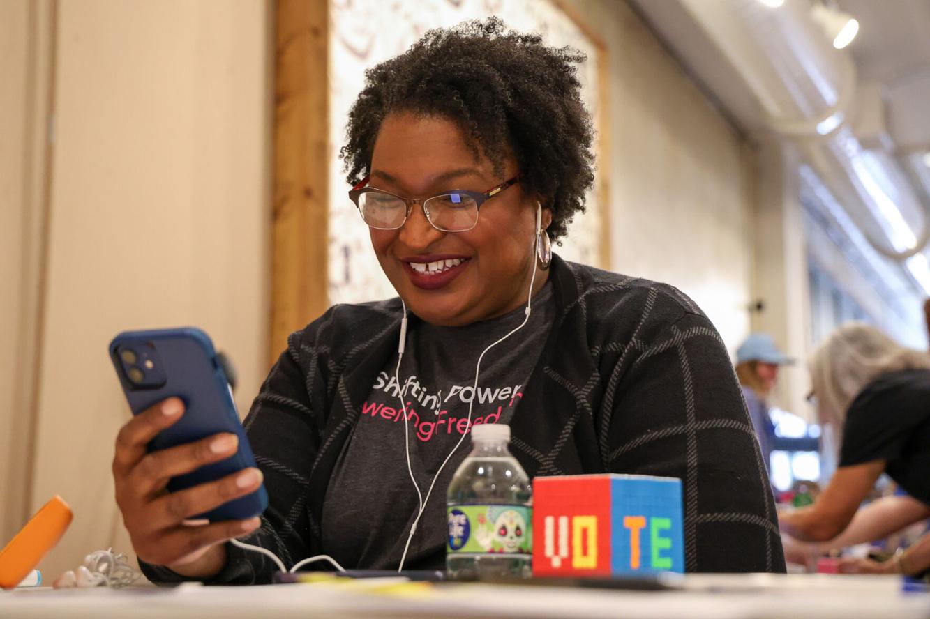 Stacey Abrams phone banks at Harris-Walz campaign office in downtown ...