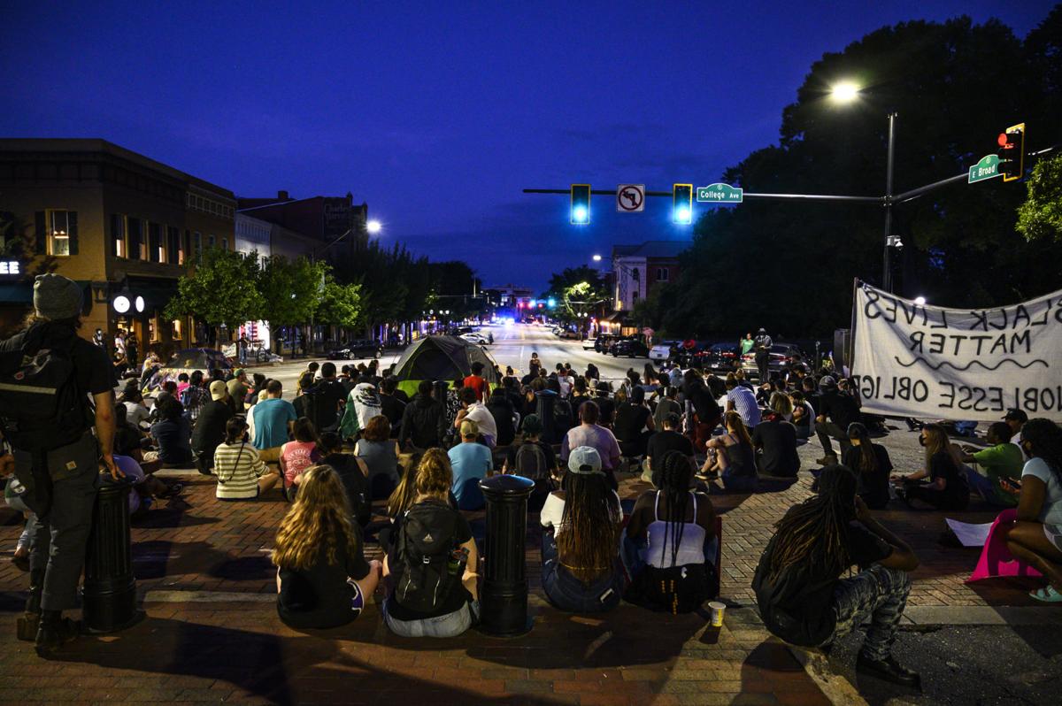 Police use tear gas to disperse Athens protesters at the Arch | City ...