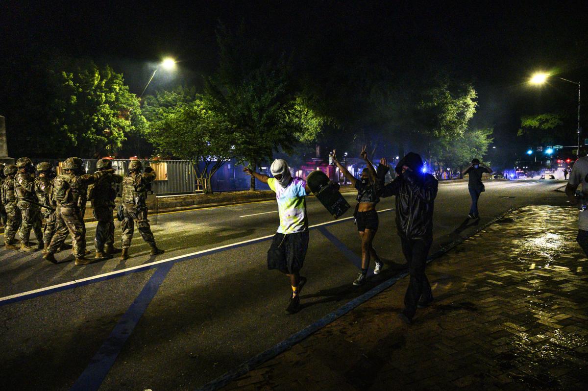 Police use tear gas to disperse Athens protesters at the Arch | City ...