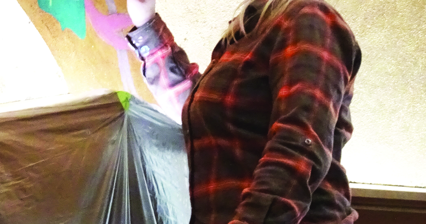 Local artist restores decade-old religious symbols at First ...