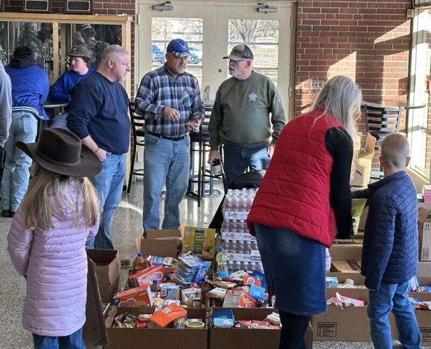 Flood of volunteers pack hundreds of food boxes | APG State News ...