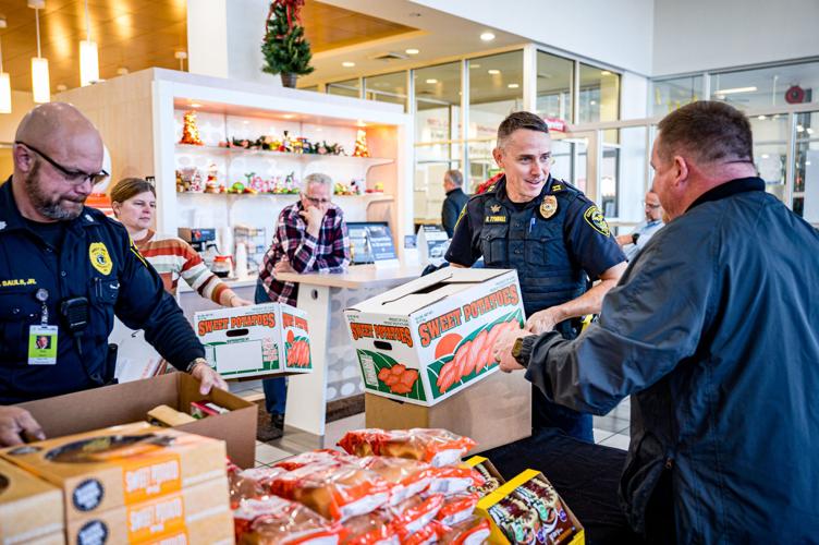 Giving blue line: Police provide 100 Thanksgiving dinners to local ...