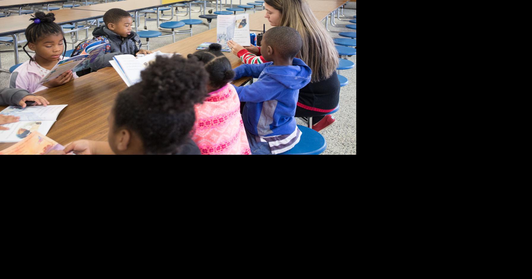 The gift of reading: Kiwanis members send books home with students in ...