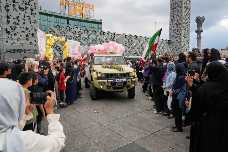 Photos of a mass wedding and a colorful missile at Tehran's 'Sacrifice ...