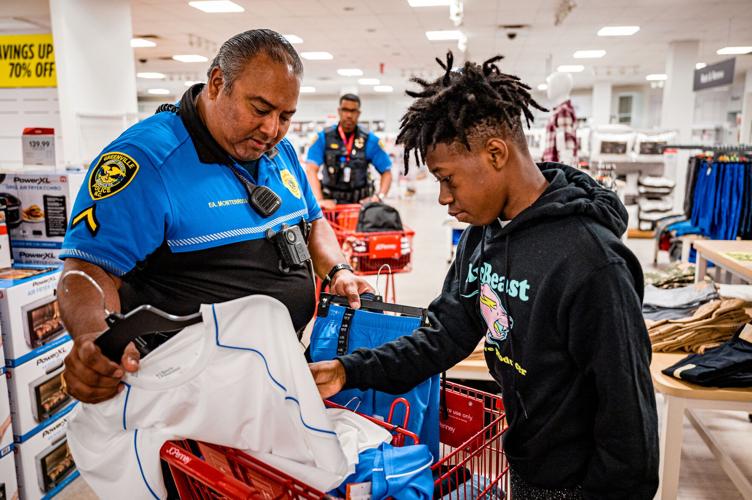 Shop with a Cop: Event sets up school kids with clothes; free haircuts ...