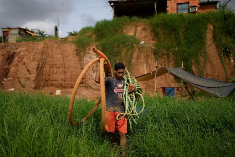 Photos show miners in El Callao, Venezuela, where gold has become an ...
