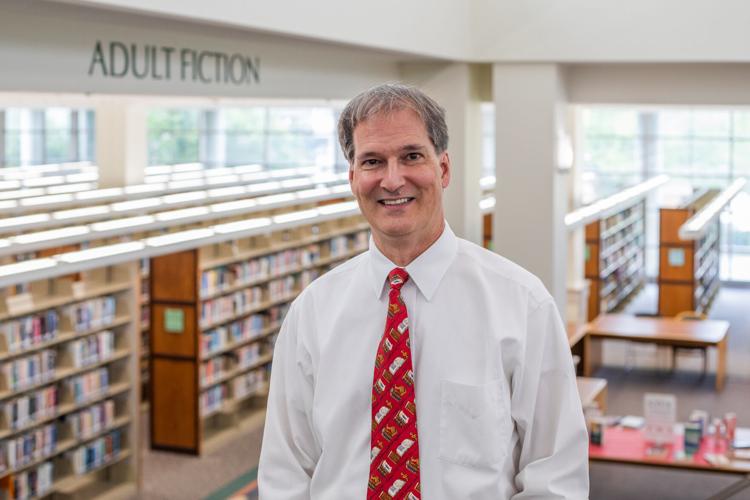 What are you reading? Technology aside, library director still prefers ink and paper | Local ...
