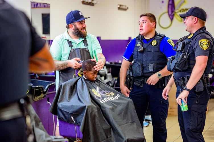 Cops and Barbers help families prepare for back to school | Local News ...