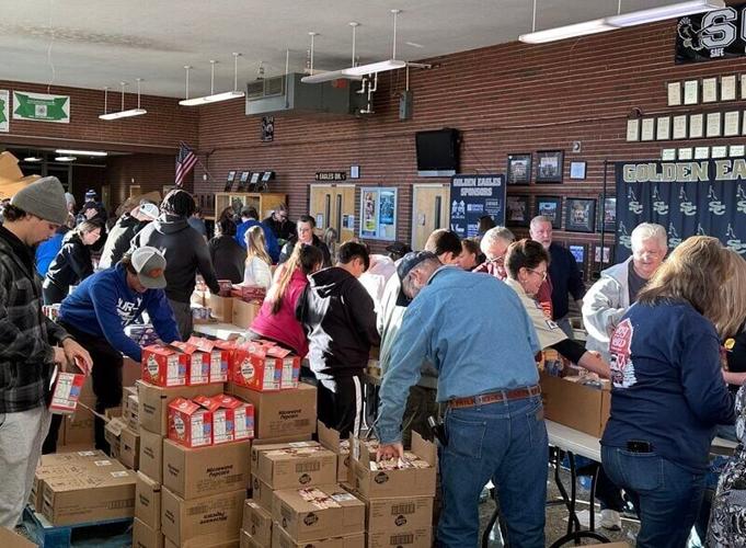 Flood of volunteers pack hundreds of food boxes | APG State News ...