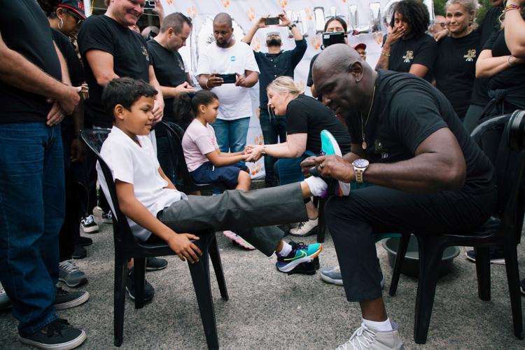 A perfect fit: Company, charity bring Shoes of Hope mission to Building ...