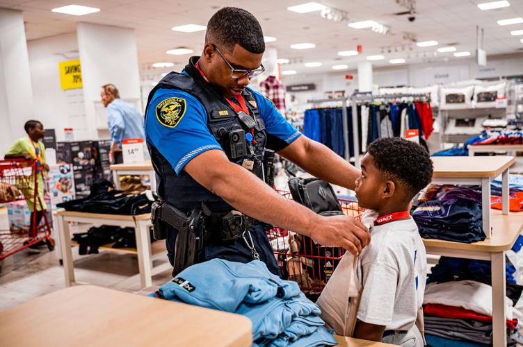 Shop with a Cop: Event sets up school kids with clothes; free haircuts ...