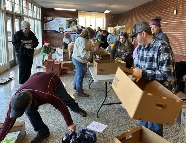 Flood of volunteers pack hundreds of food boxes | APG State News ...