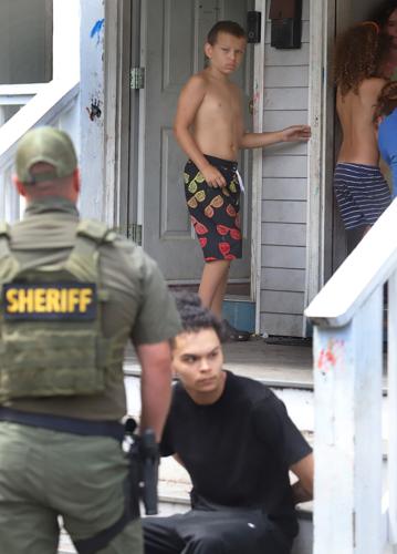 Simultaneous police drug raids net gangs, guns and cash in Bennington ...