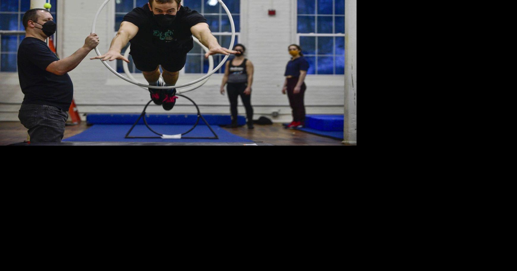 Diving to success: Cirque du Soleil program teaches hoop diving at New ...