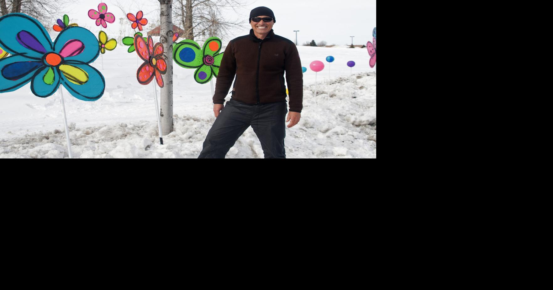 Flower-bombed: Hastings artist creates smiles with mobile flower ...