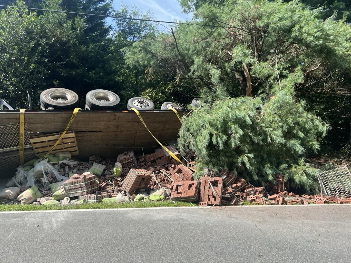 Genito closed after tractor trailer hauling bricks overturns