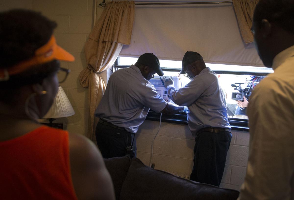 PHOTOS: Gilpin Court senior residents receive new A/C units