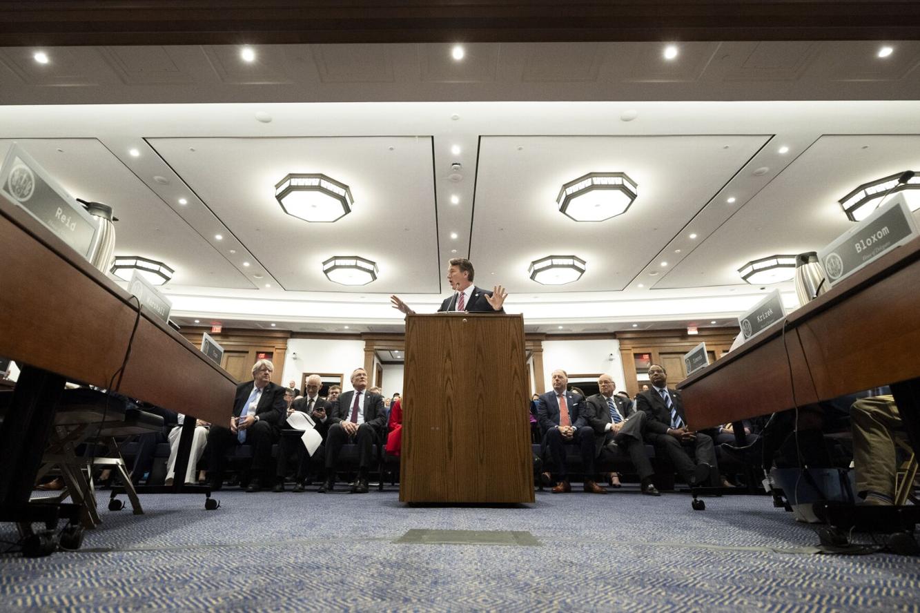 Virginia governor to cut $900 million from budget as buffer
