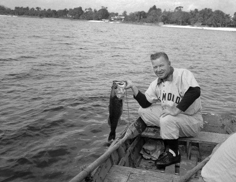 LUNKER FOR LOPAT--Virginians manager Eddie Lopat shows off the big bass ...