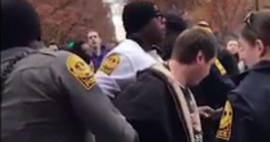 Man holding sign with racial slur arrested on VCU's campus