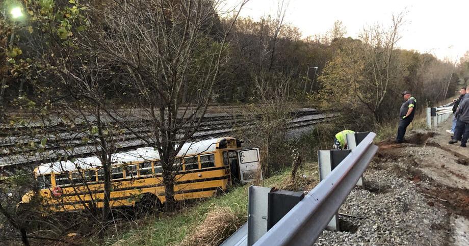Four injured after crash sends Virginia school bus through guardrail ...