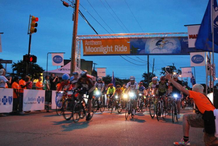 Thousands Bike at Night in Moonlight Ride