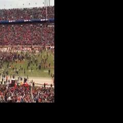 UVA fans storm the field after beating Virginia Tech