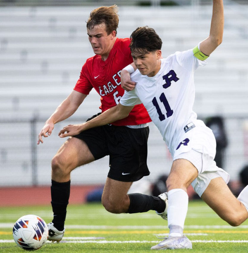 Boys soccer: Travis hits bullseye twice, Godwin wins title