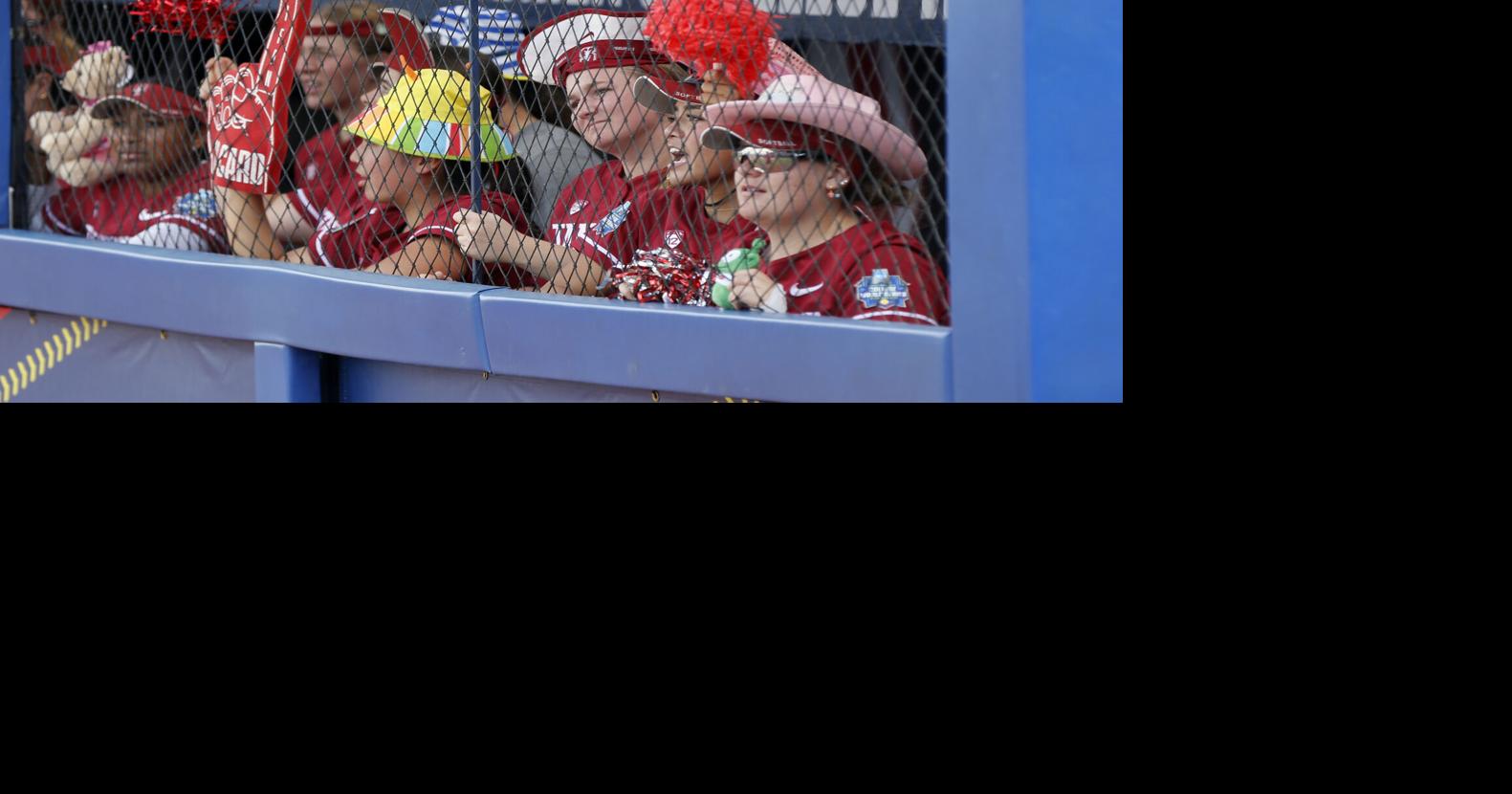 College softball players bring cheers, chants to dugout