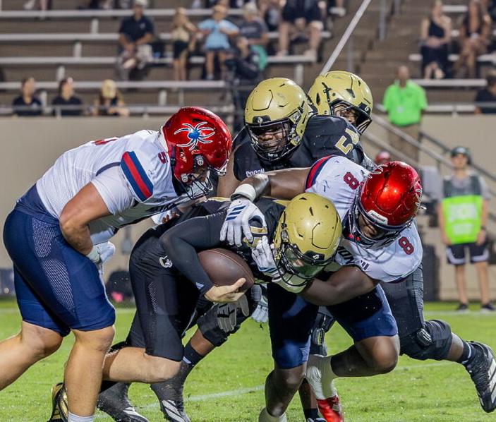 Defense, power running from QB get Spiders win at Wofford