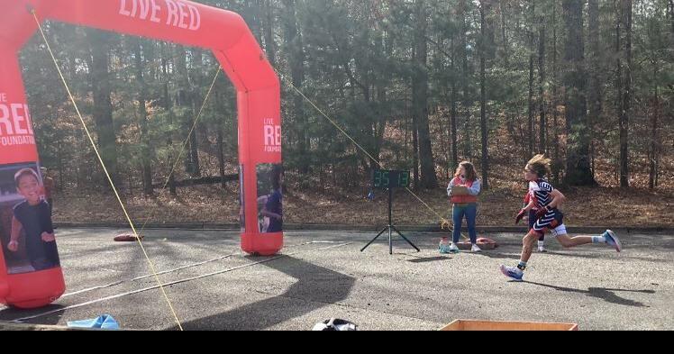 Contestant prepares to cross finish line