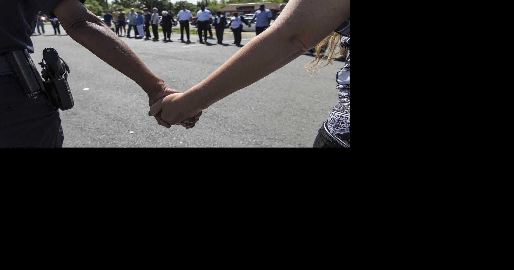 Police, faith leaders walk, pray in Richmond public housing communities
