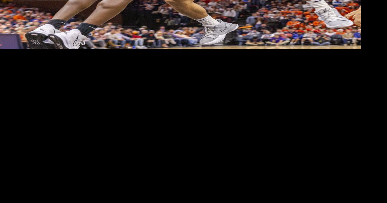 'Old' No. 3 Virginia shows poise down the stretch, holds off JMU 55-50