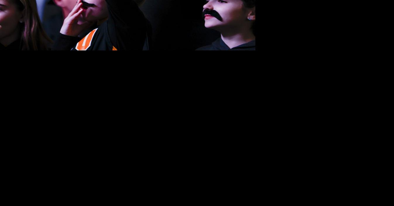 VCU fans donning mustaches in honor of Rams sharpshooter David Shriver