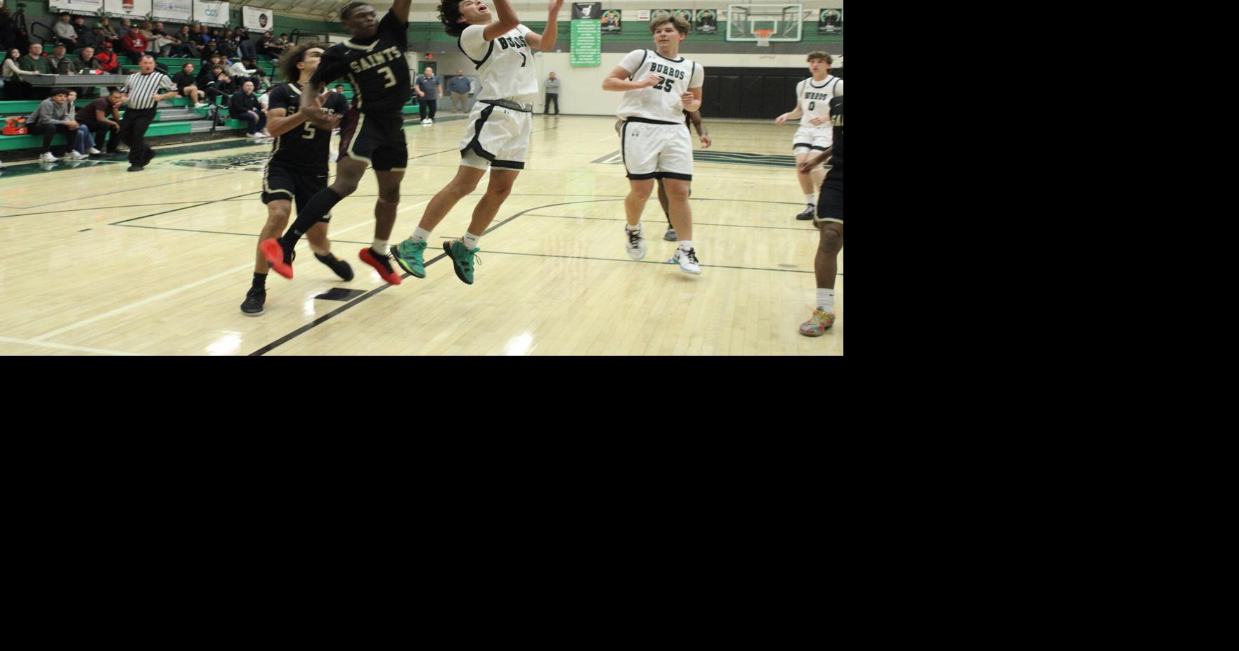 Burroughs boys basketball’s second-half run falls short against Saints ...