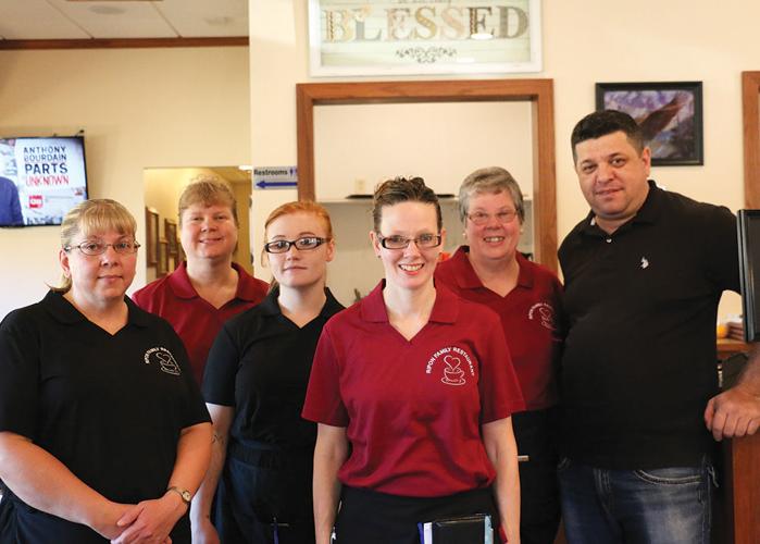 Back in business: Almost a year after a fire nearly destroyed the ...