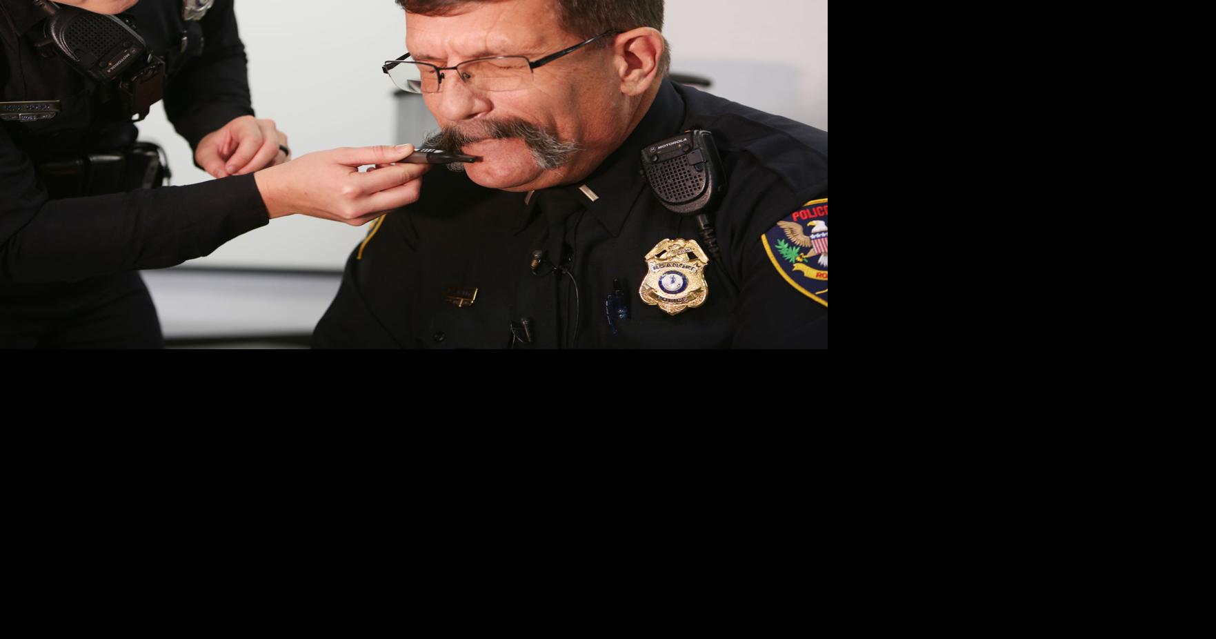 Roanoke police lieutenant shaves 36-year-old mustache for charity