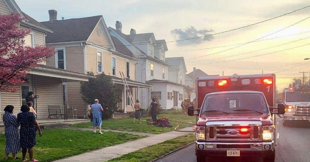 Roanoke first responders rescue person from roof of burning house