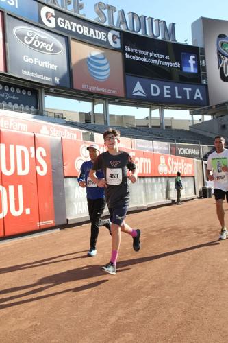 Gary and Hunter Collin run inside Yankee Stadium to raise money for ...